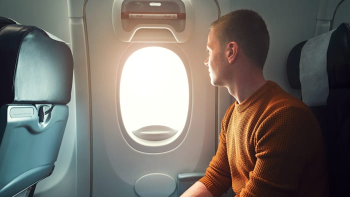 The Best Stretches You Can Do When Traveling On a Plane