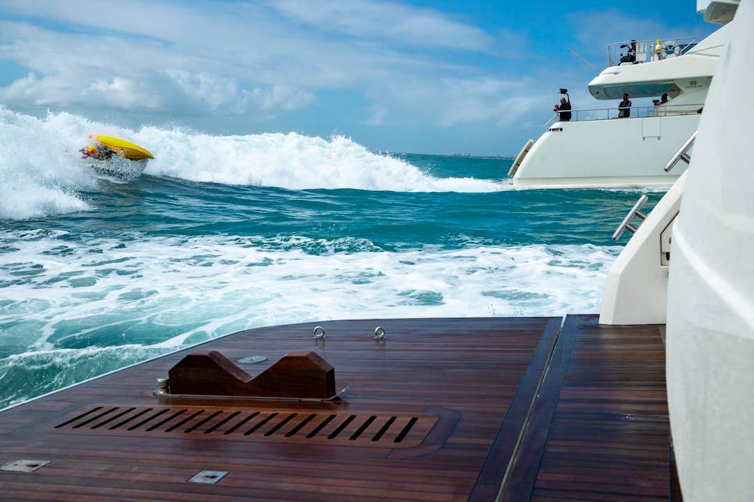 Kayaker Dane Jackson Surfs Wake Between a Pair of Miami Yachts
