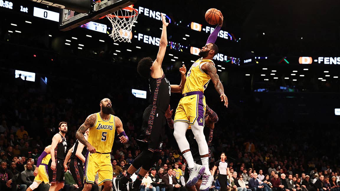 Basketball Players Slam Dunk