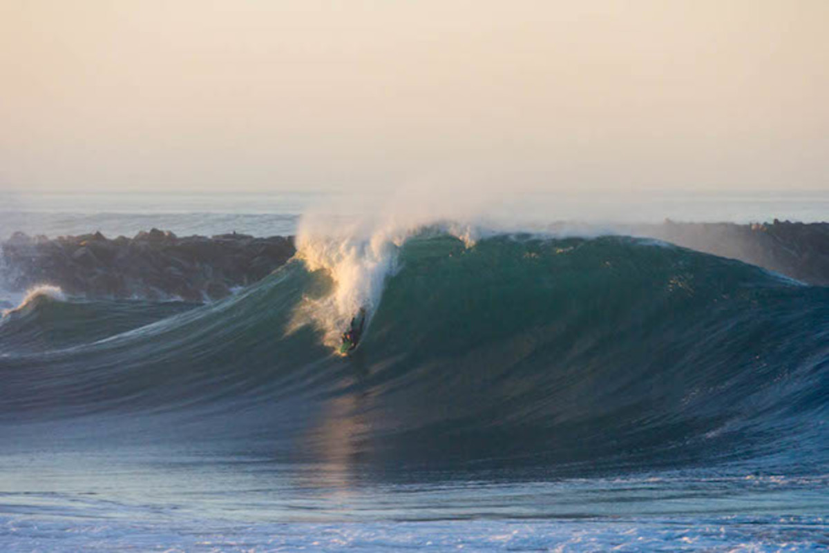 Surfers brave massive waves at the Wedge