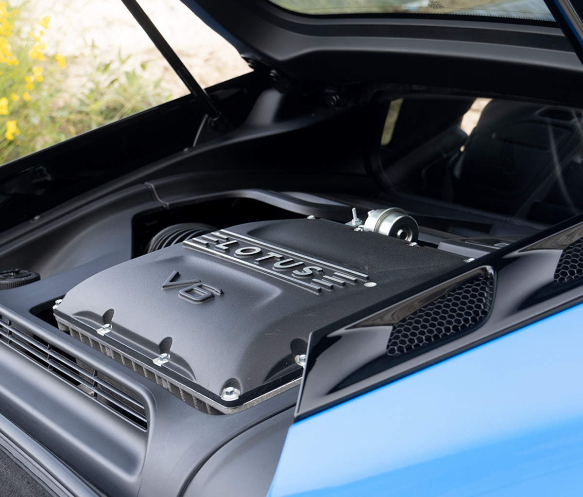 First Drive: The Lotus Emira Is a Stunning Mini Supercar - Men's Journal