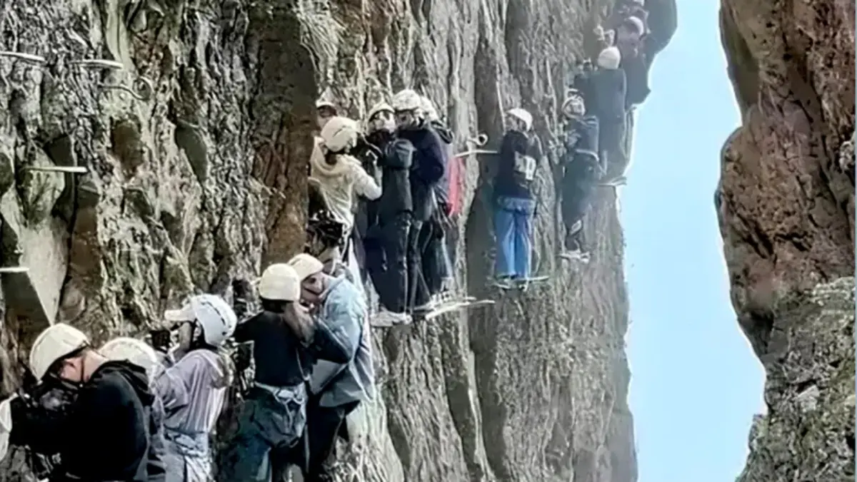 Social Media Photo Shows Crowded Climbers Stranded on Cliffside for ...