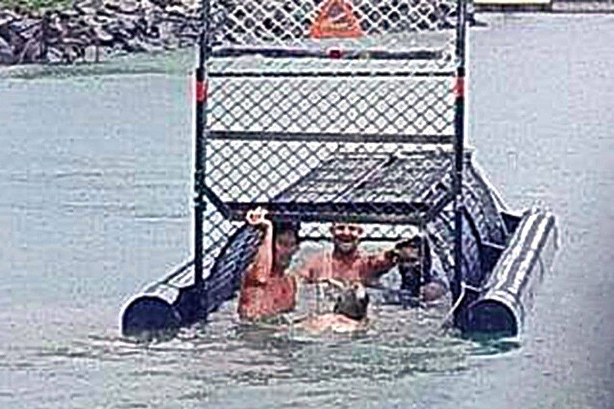 ‘Idiots’ swim into baited crocodile trap near fatal attack - Men's Journal