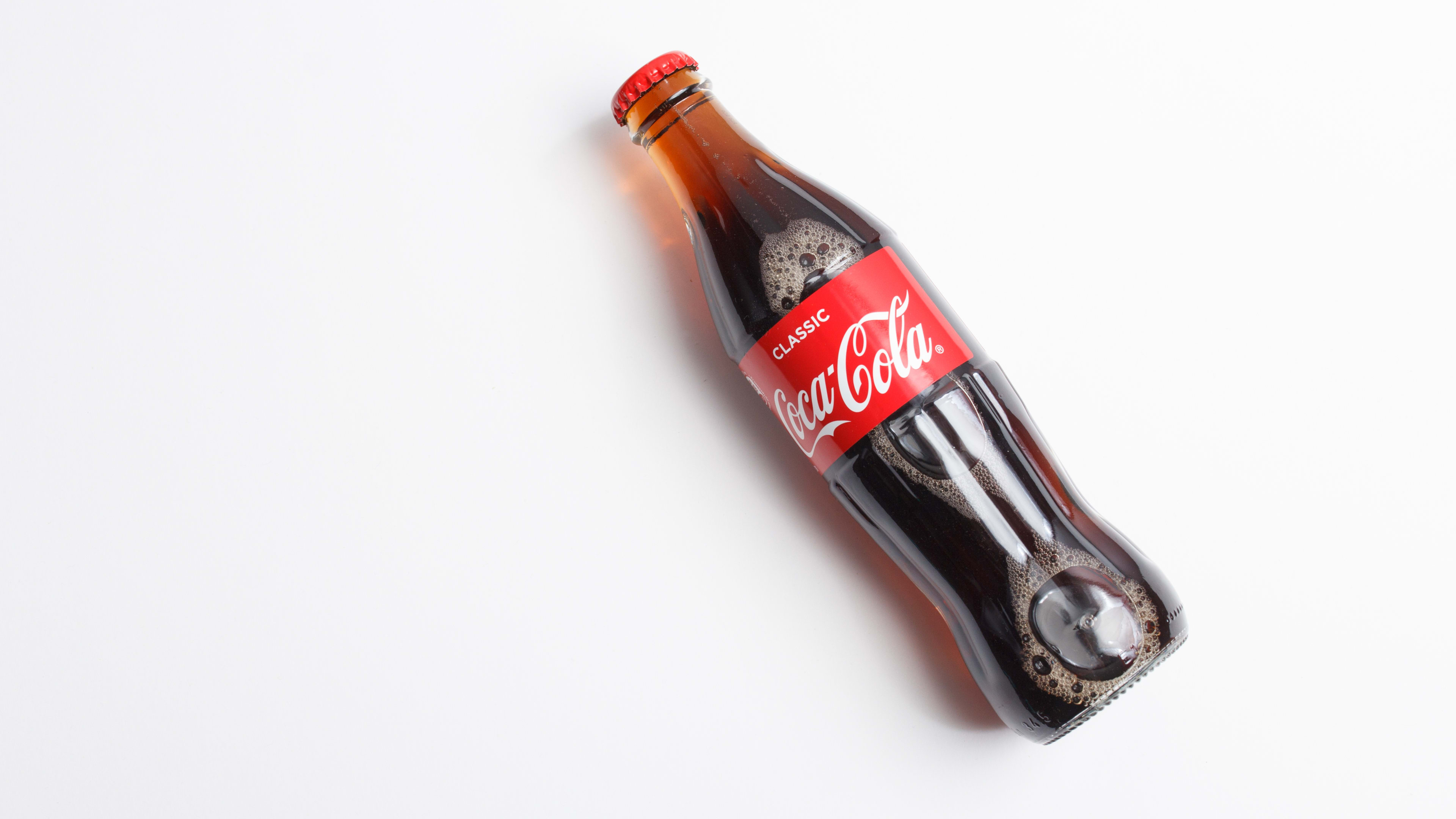 Coca-Cola Is Updating Its Famous Glass Bottle Design - Men's Journal