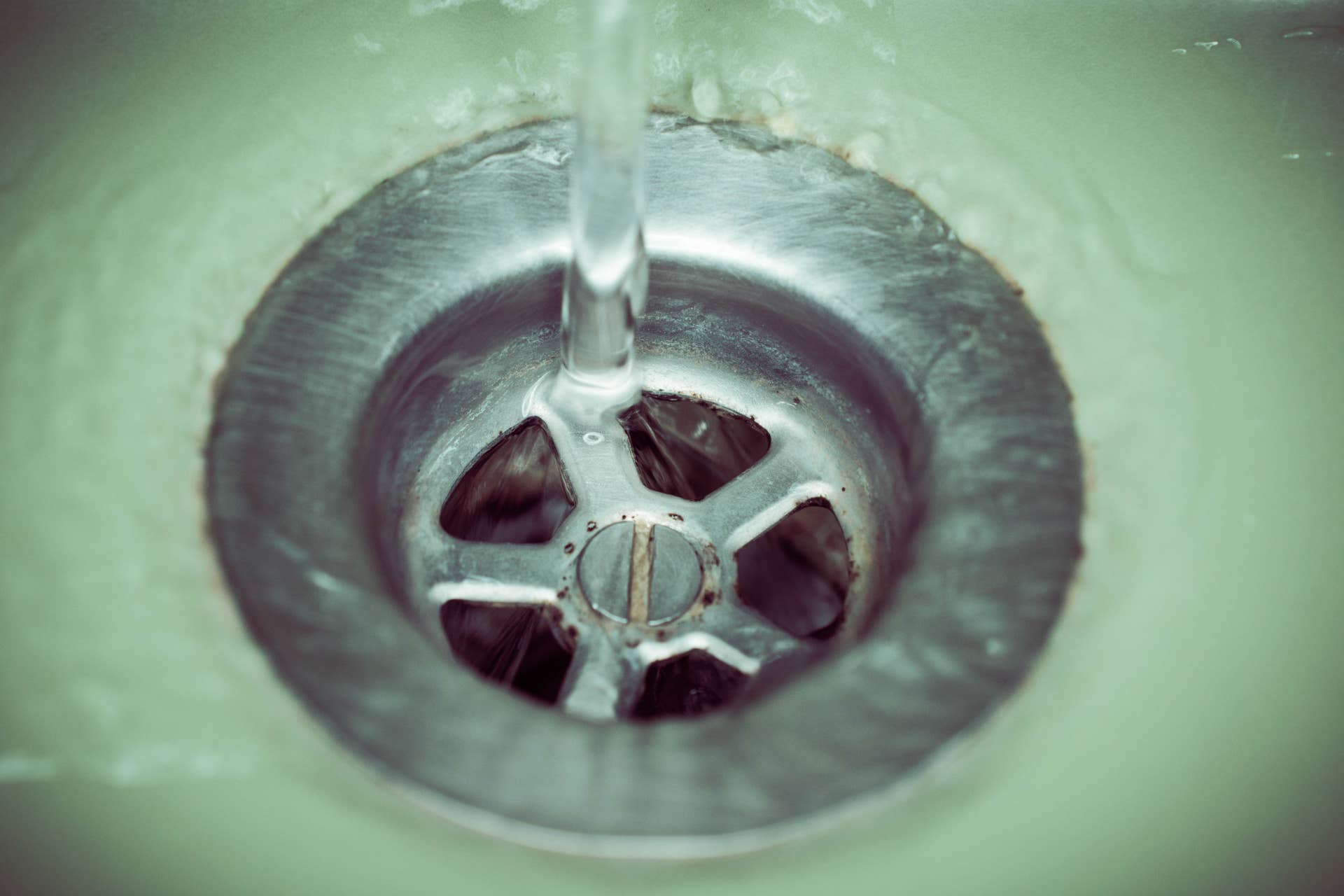 How to Fix a Slow-Draining Shower With Just a Plunger - Men's Journal