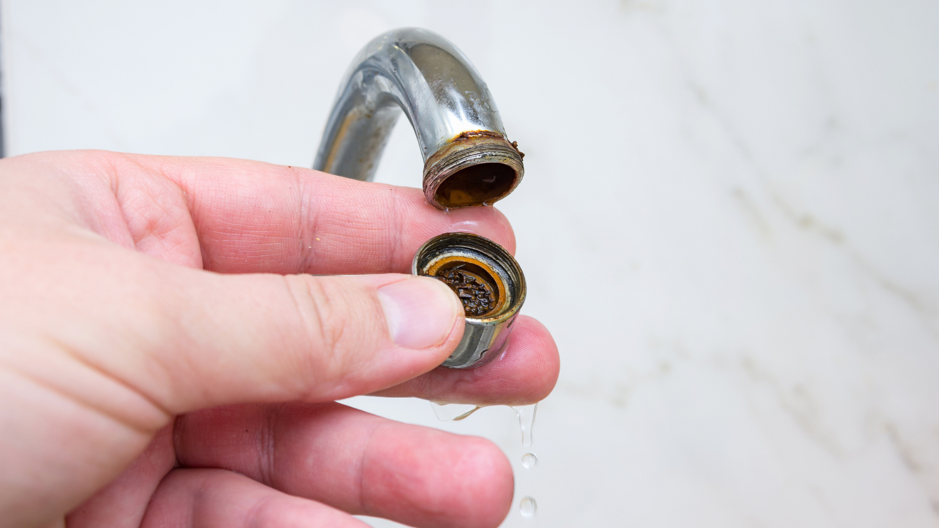 How to Clean a Faucet Head and Remove Hard Water Stains - Men's Journal