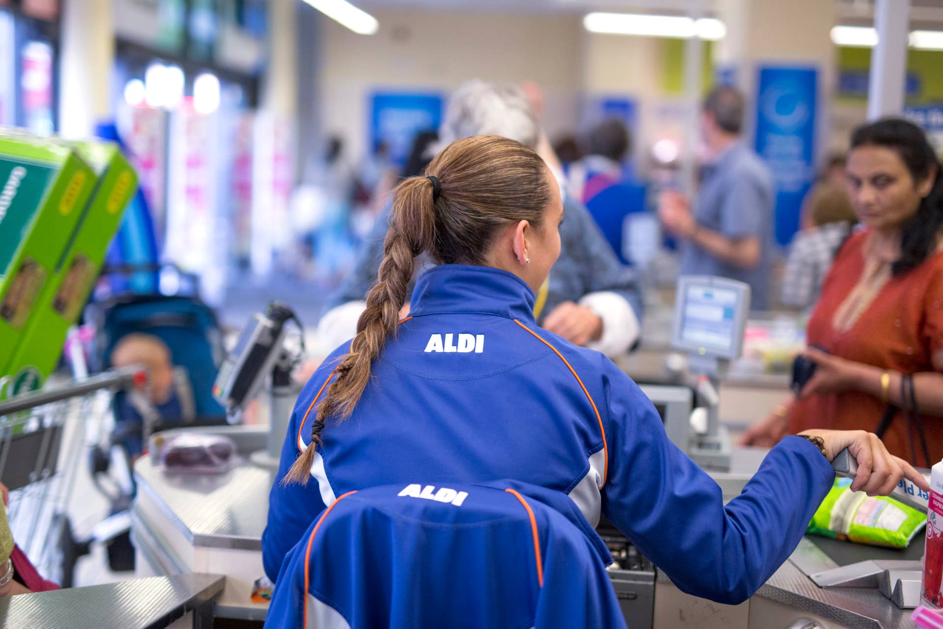 Why Aldi Cashiers Take a Seat at Checkout Lanes - Men's Journal